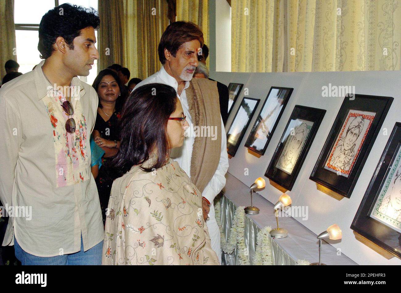 Bollywood actor Amitabh Bachchan, right, his wife Jaya Bachchan, center ...