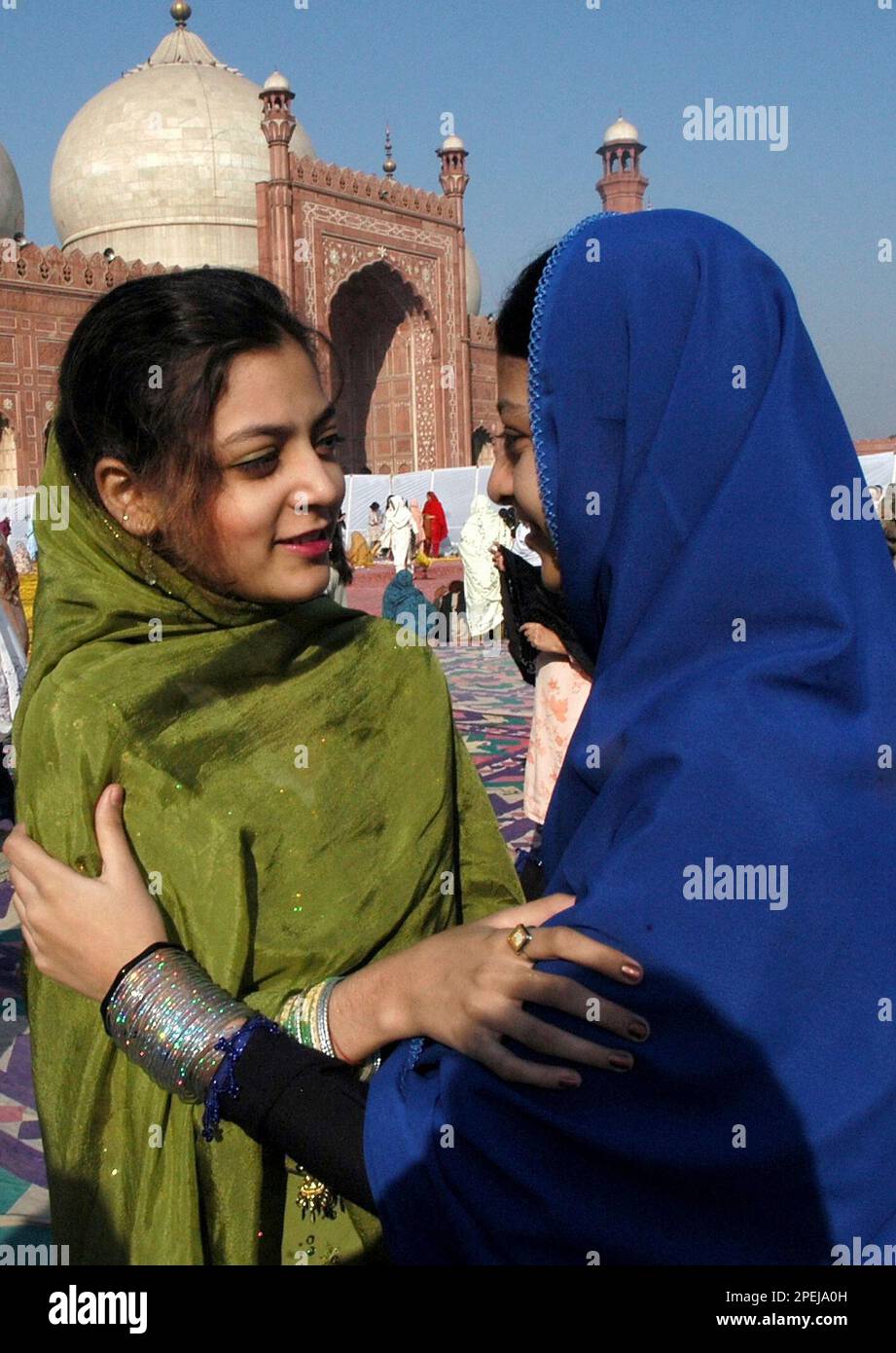 Pakistani Muslim girls share Eid greeting after Eid Al-Fitr prayer at ...