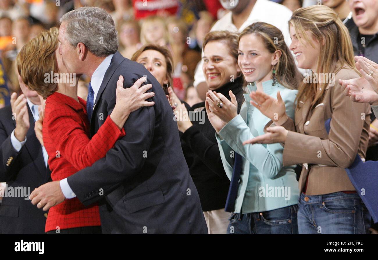 First lady Laura Bush, left, surprises her husband President Bush and ...
