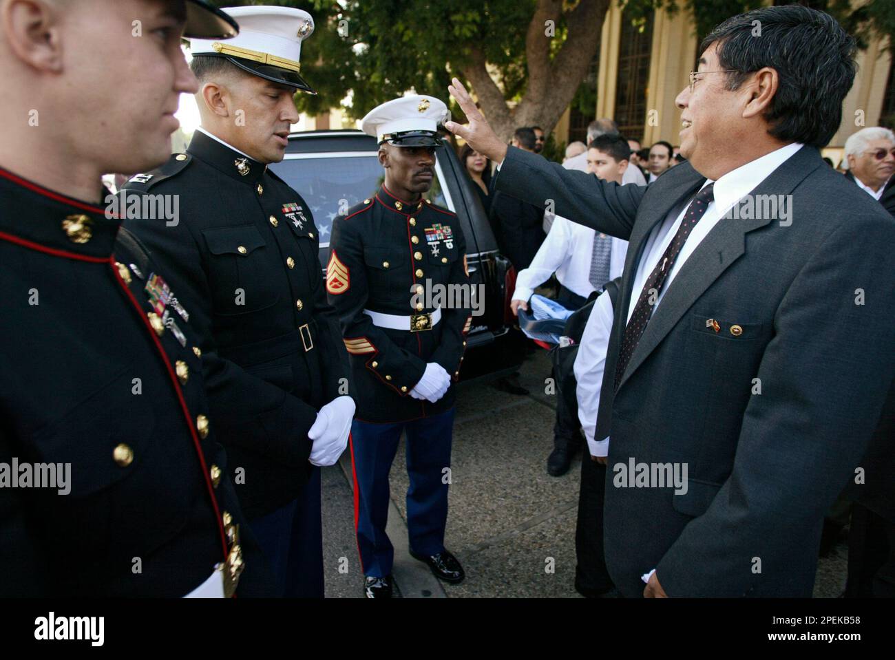 Gustavo Salazar, right, father of Las Vegas Marine Cpl. William I ...