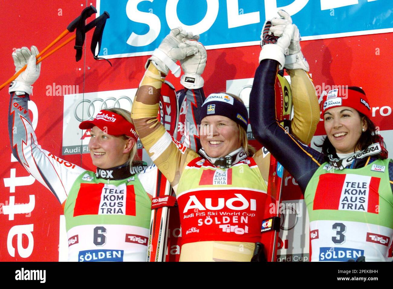 Winner Anja Paerson from Sweden, center celebrates on the podium with ...