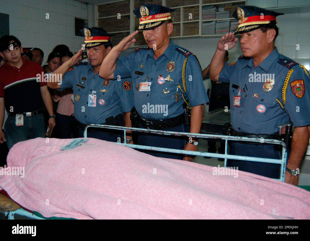Philippine National Police Chief Gen. Edgardo Aglipay, center, Manila's Western Police District ...