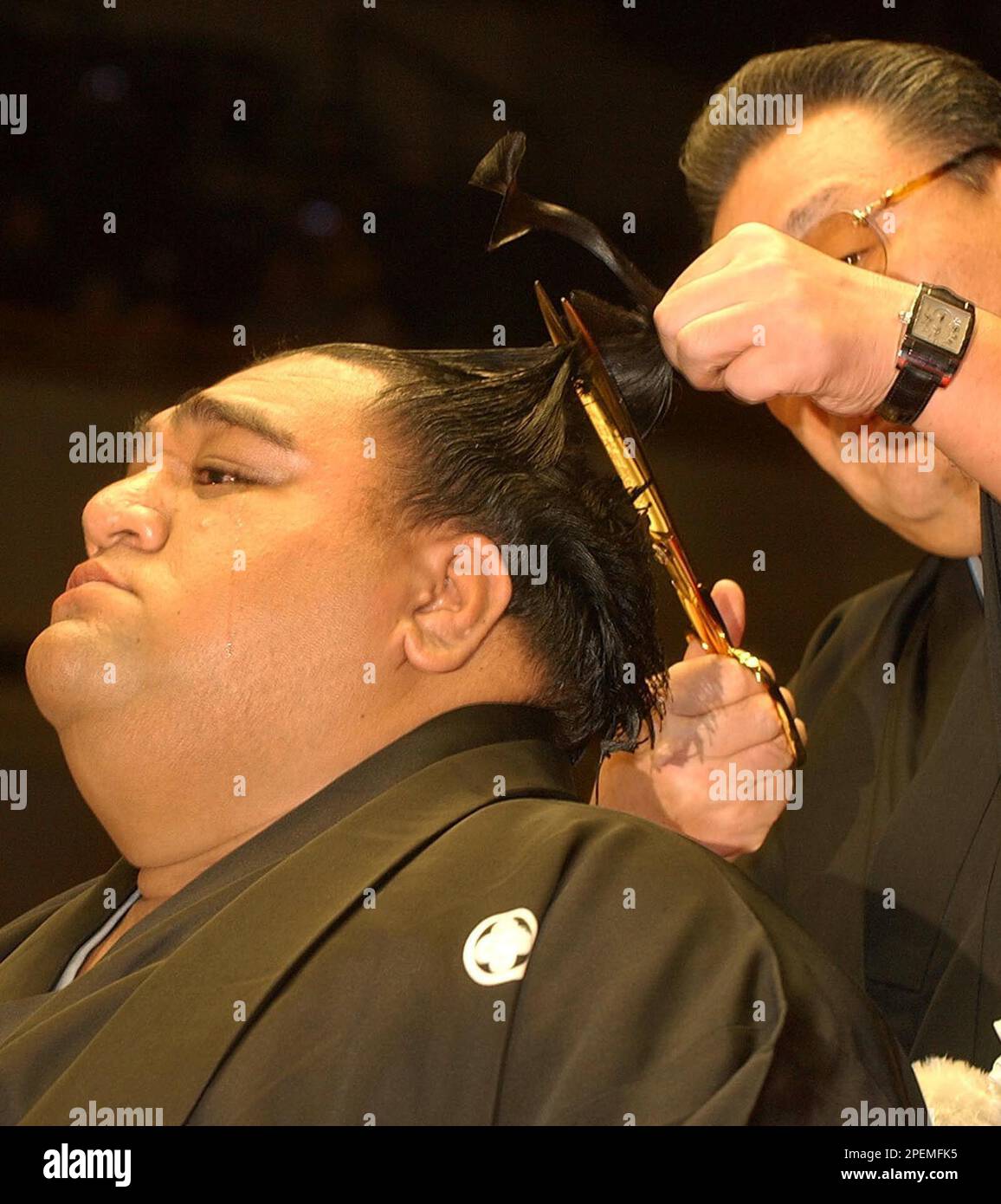 Former grand champion Musashimaru sheds a tear as his stablemaster ...