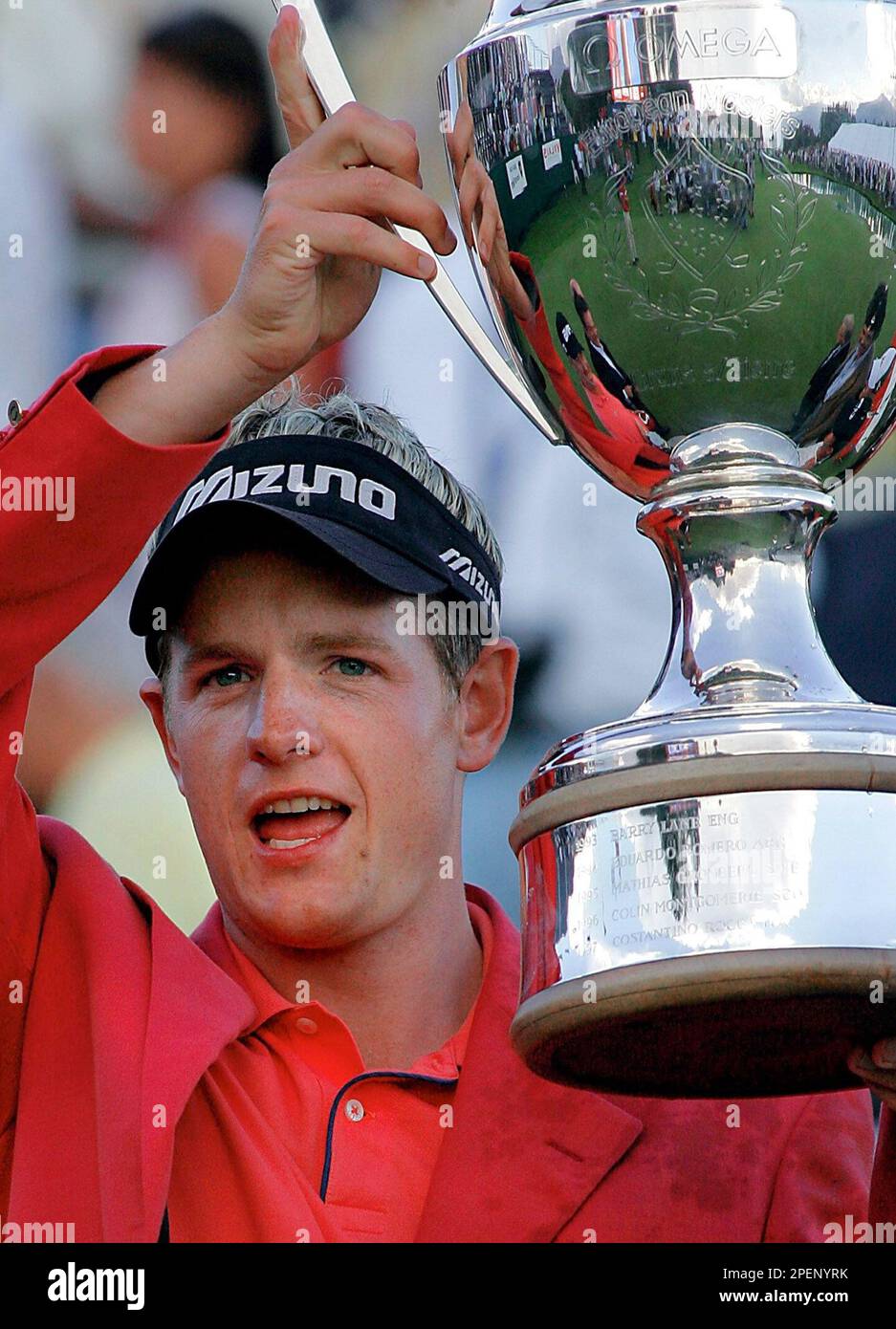 Luke Donald of England poses with the winner's trophy after winning the ...