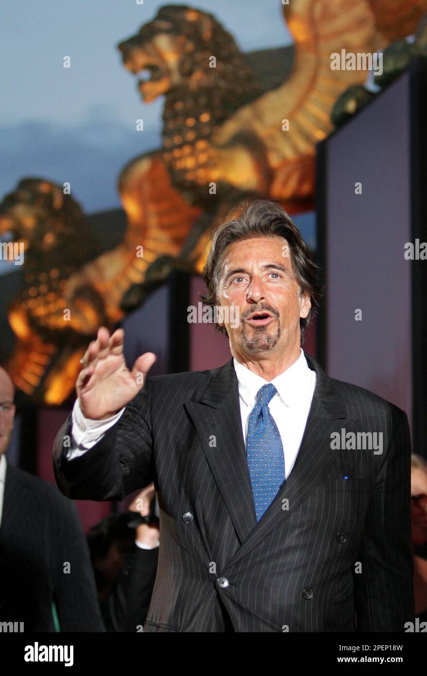 U.S. movie star Al Pacino waves as he arrives for the presentation of ...