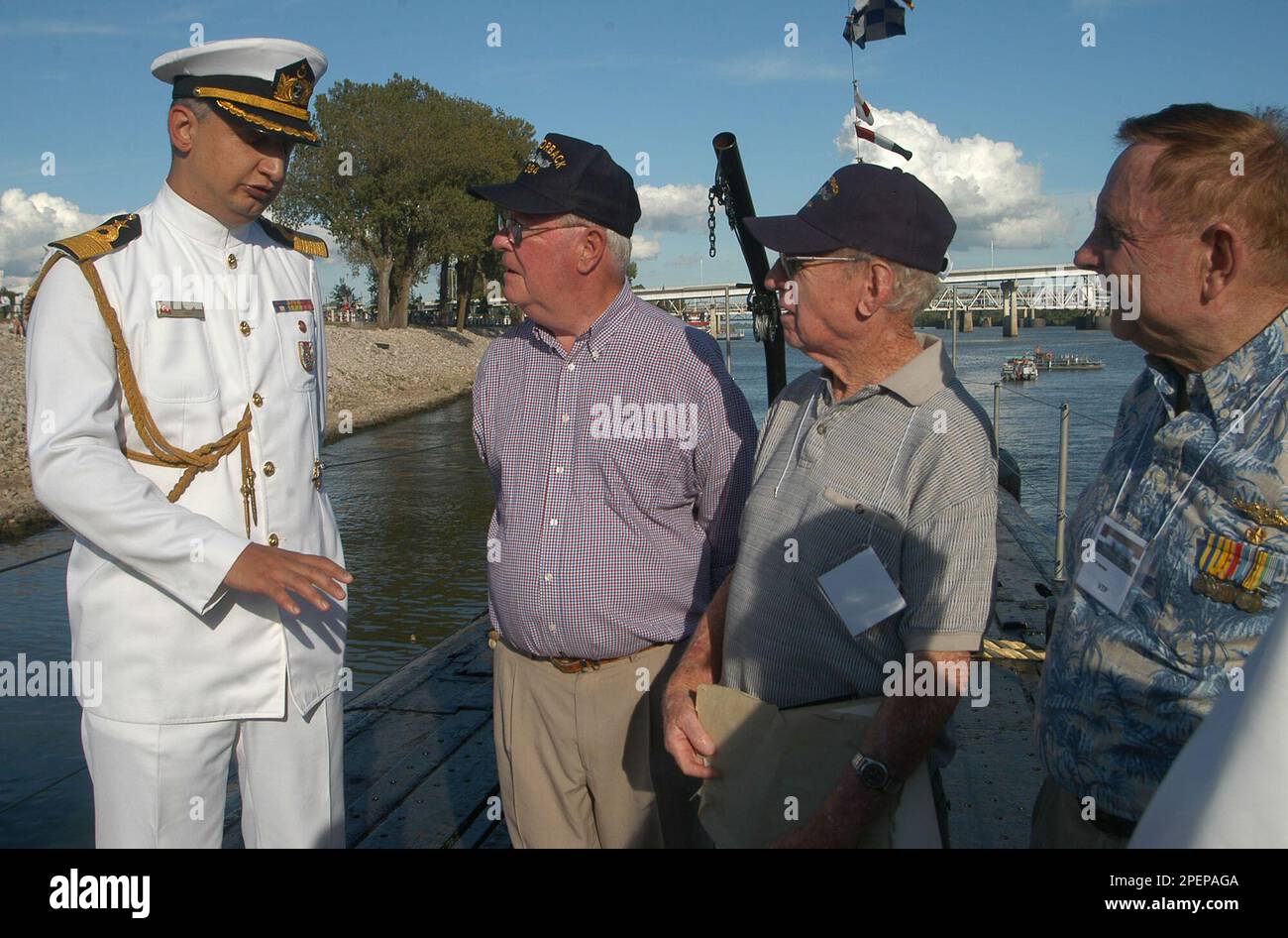 Turkish Navy Capt. Alaettin Sevim, left, speaks with Joseph Talbert ...