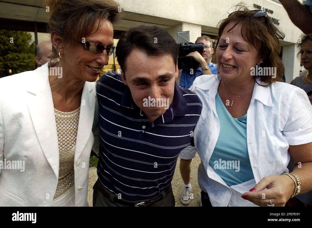 Former CIA contractor, David Passaro 38, center, is embraced by his ...