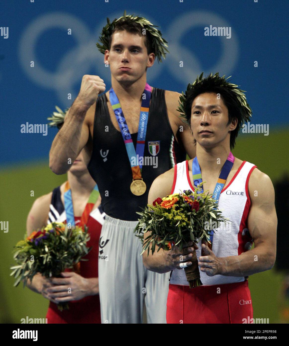 Silver-medalist Paul Hamm of the United States, left, gold-medalist ...