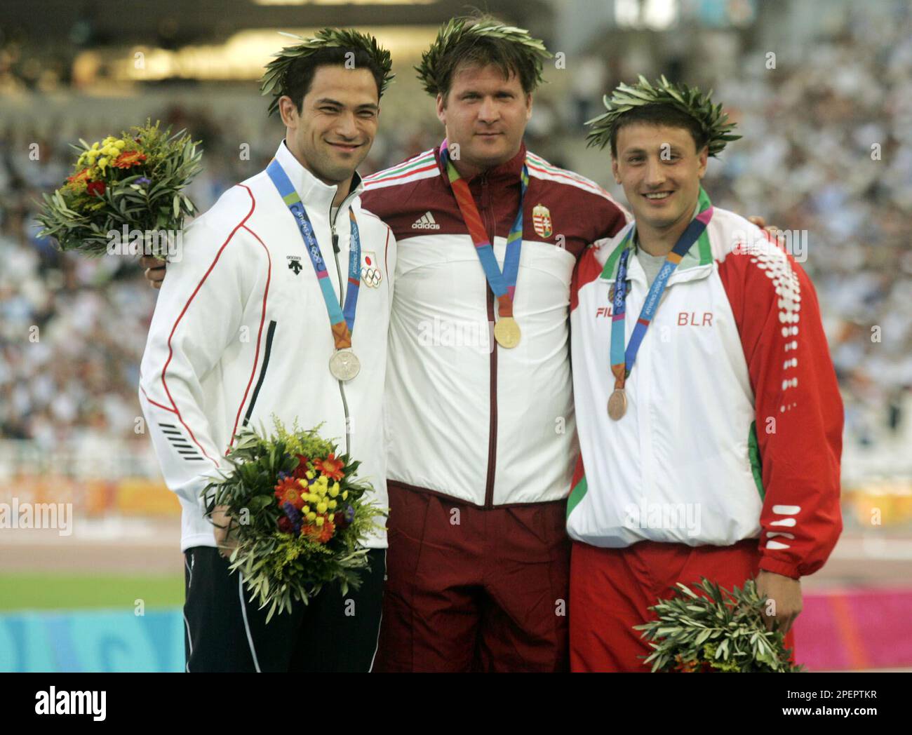 Japan's Koji Murofushi, silver, left, Hungary's Adrian Annus, gold ...