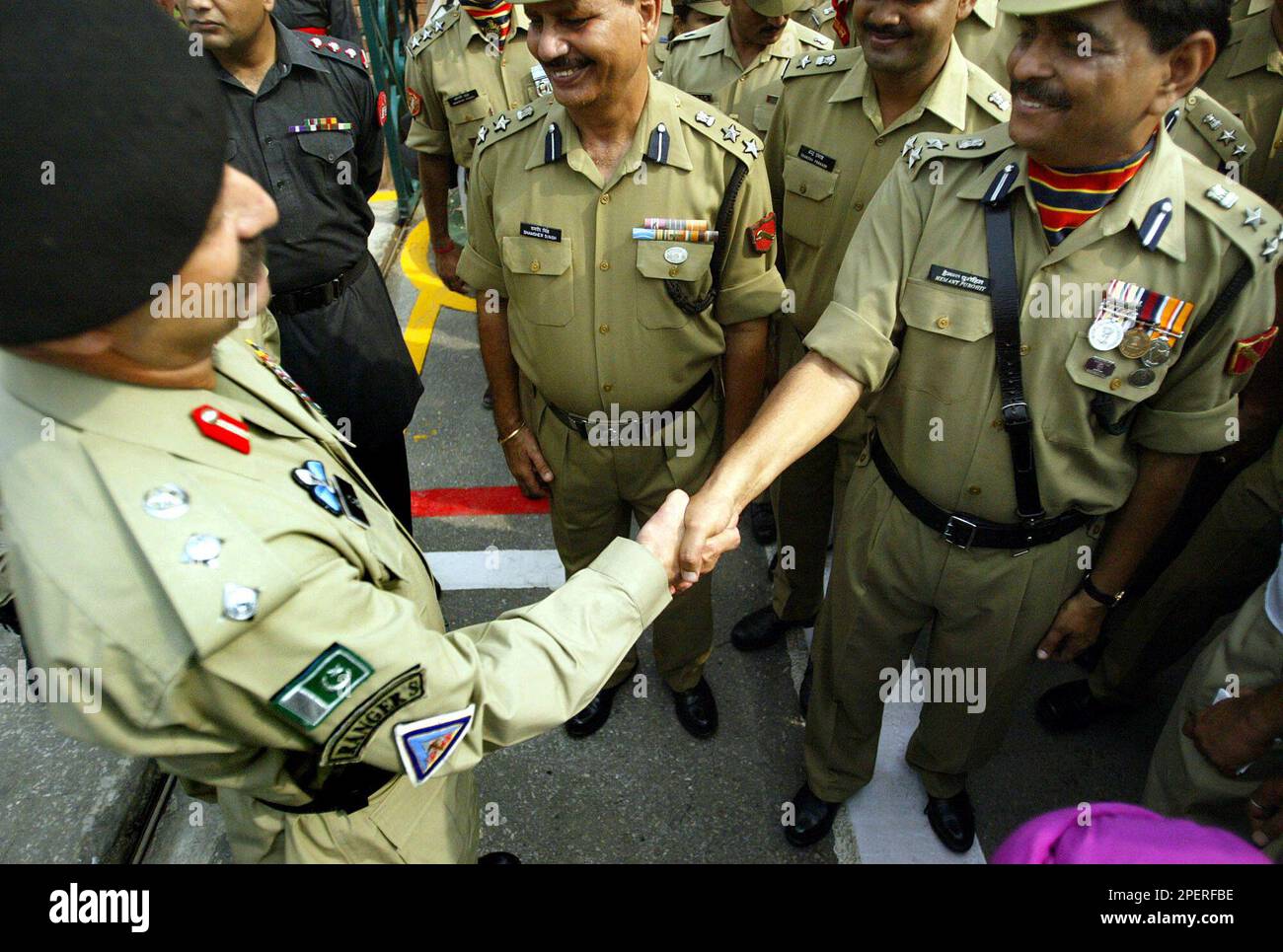 Pakistan Ranger's sector commander Mohd. Adil, extreme left, shakes ...