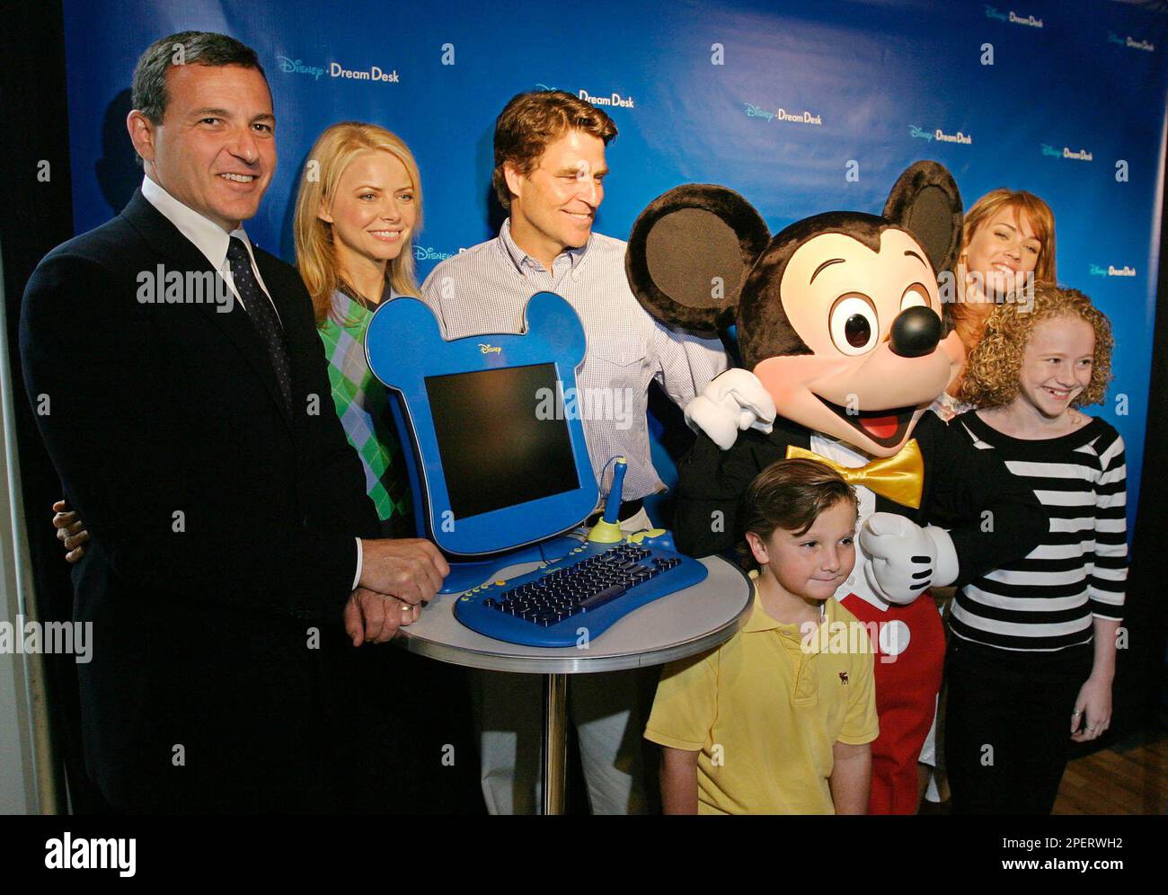 Walt Disney President Robert A. Iger, left, and Mickey Mouse, join ...