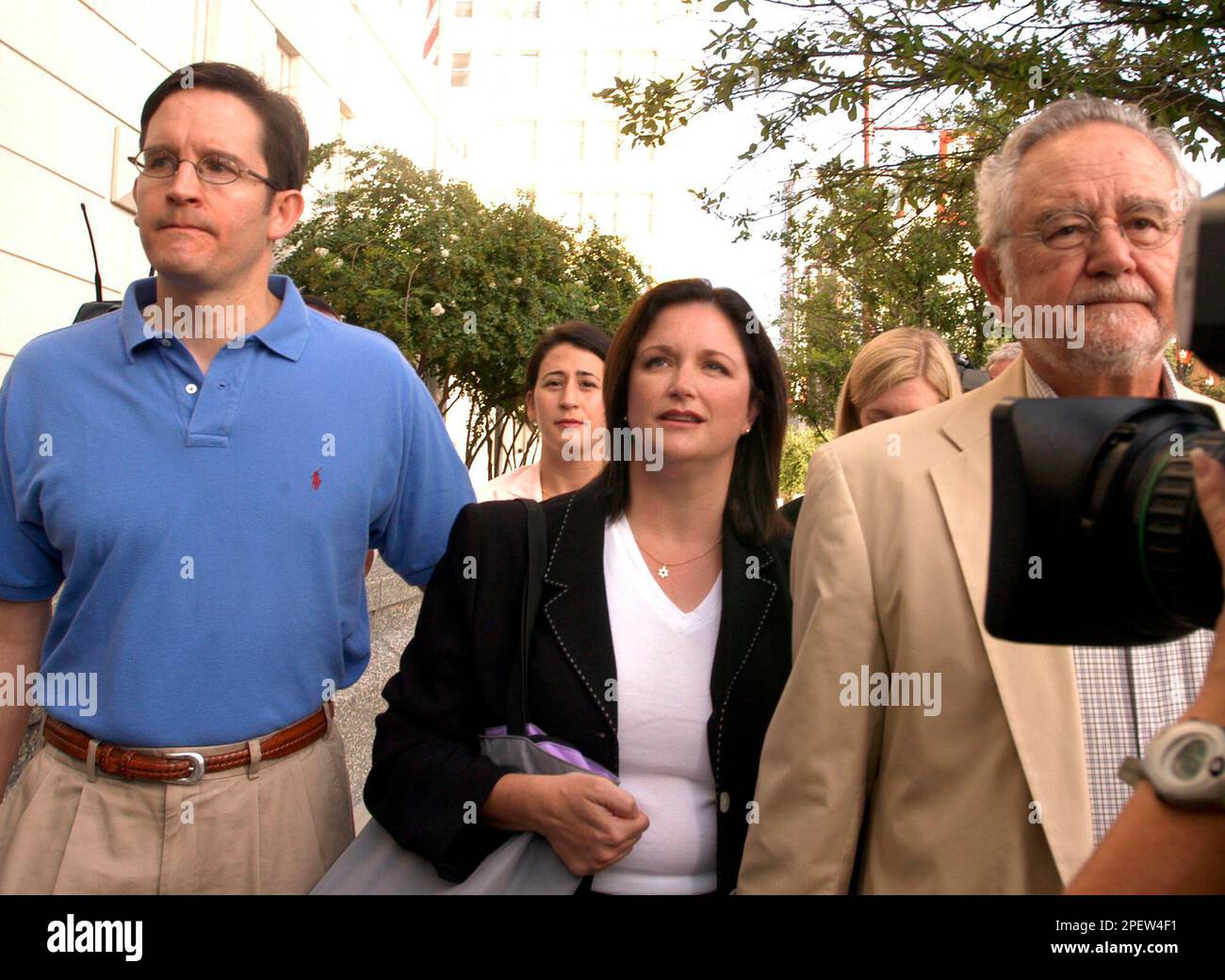 Lea Fastow, center is walked by her brother Michael and father Jack ...