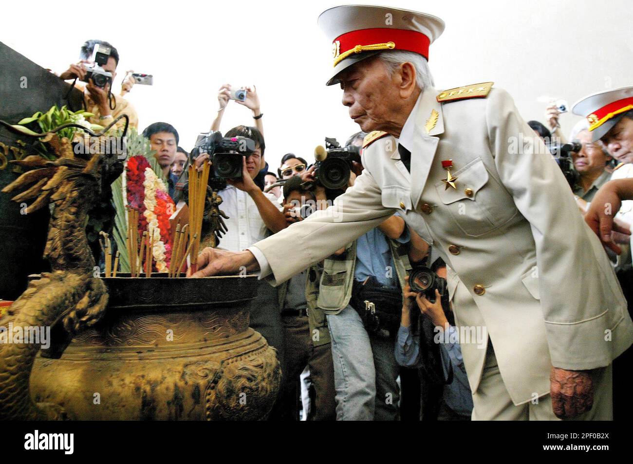 Legendary Gen. Vo Nguyen Giap, lays incense at a shrine at Dien Bien ...
