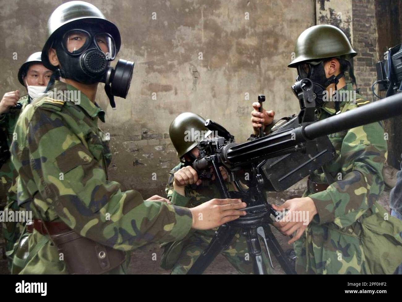 Chinese People Liberation Army (PLA) soldiers wearing gas masks prepare ...