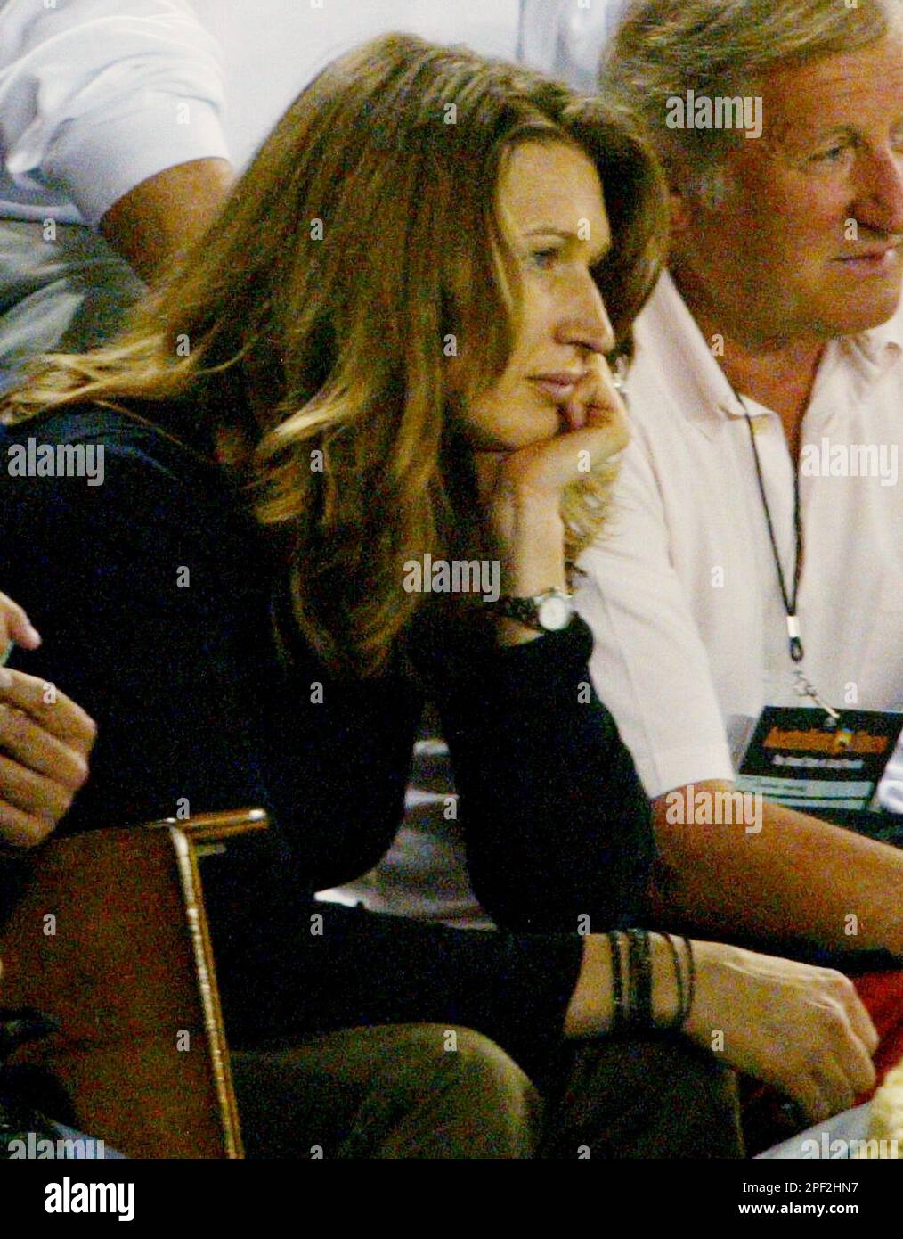 Former German tennis star Steffi Graf watches her husband Andre Agassi ...