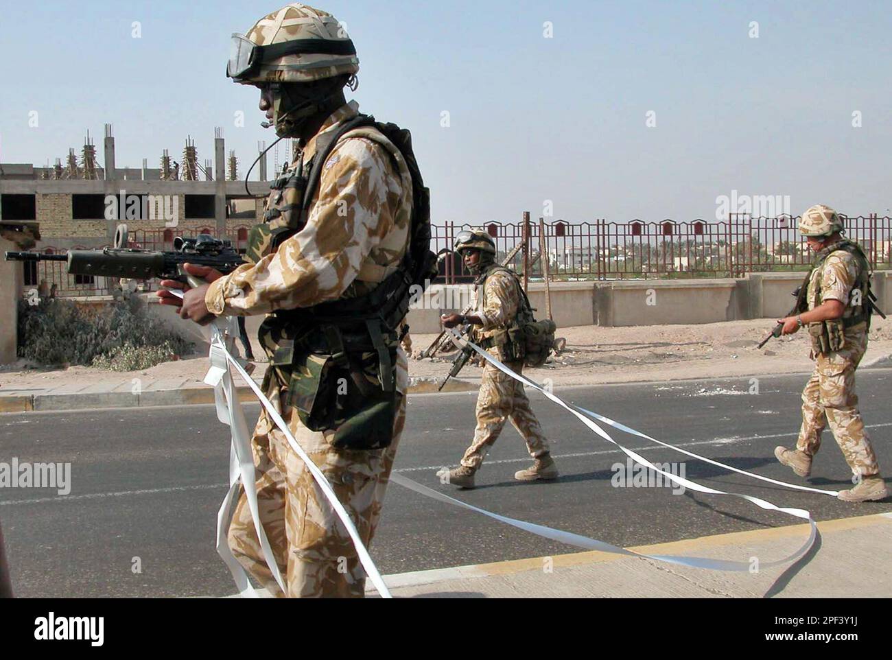 British soldiers seal off the area in Basra, southern Iraq, Sunday, Nov ...
