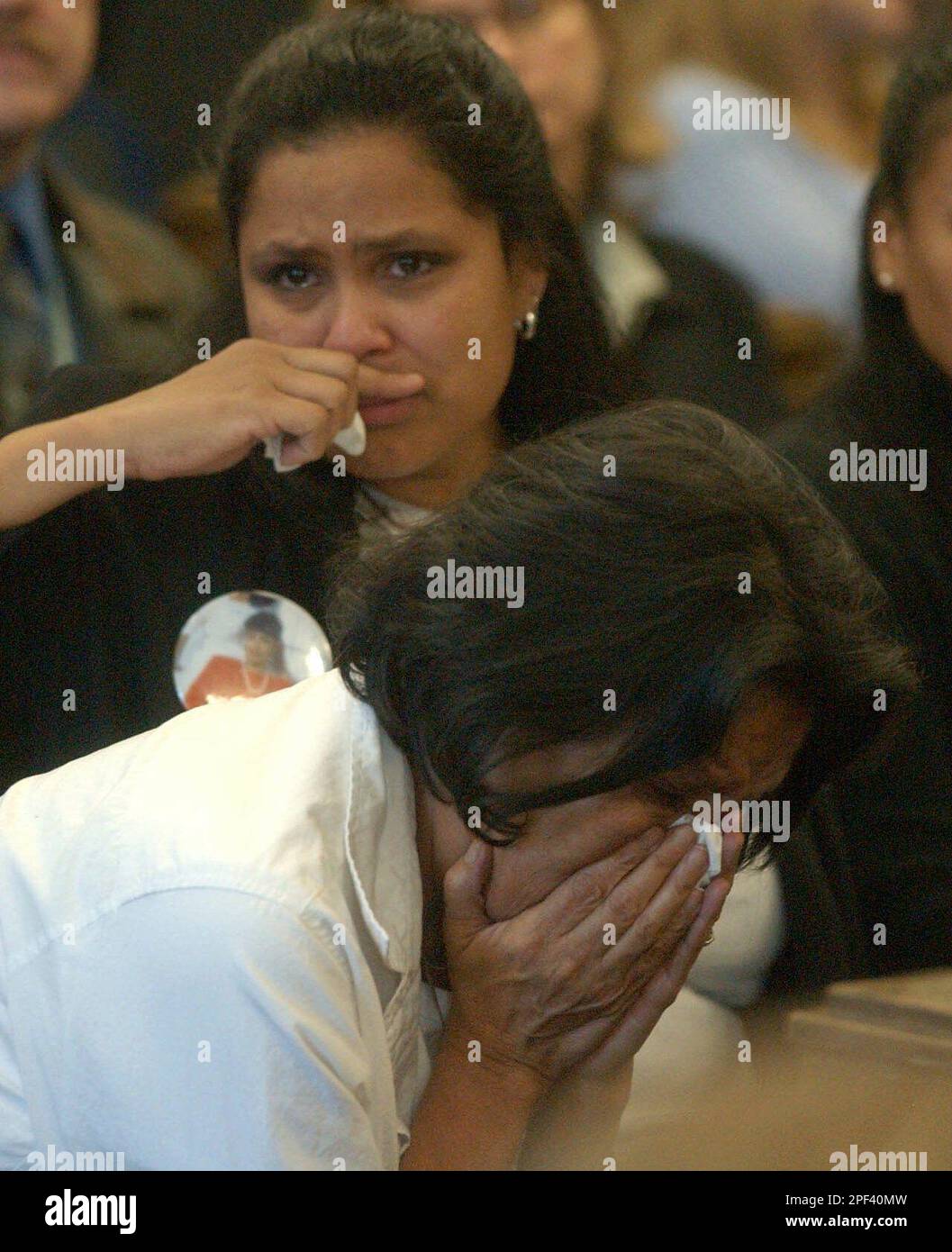 ** RETRANSMISSION TO ADD IDENTITY OF FAMILY MEMBERS ** Lucille Yellowrobe, below, of Montana and ...