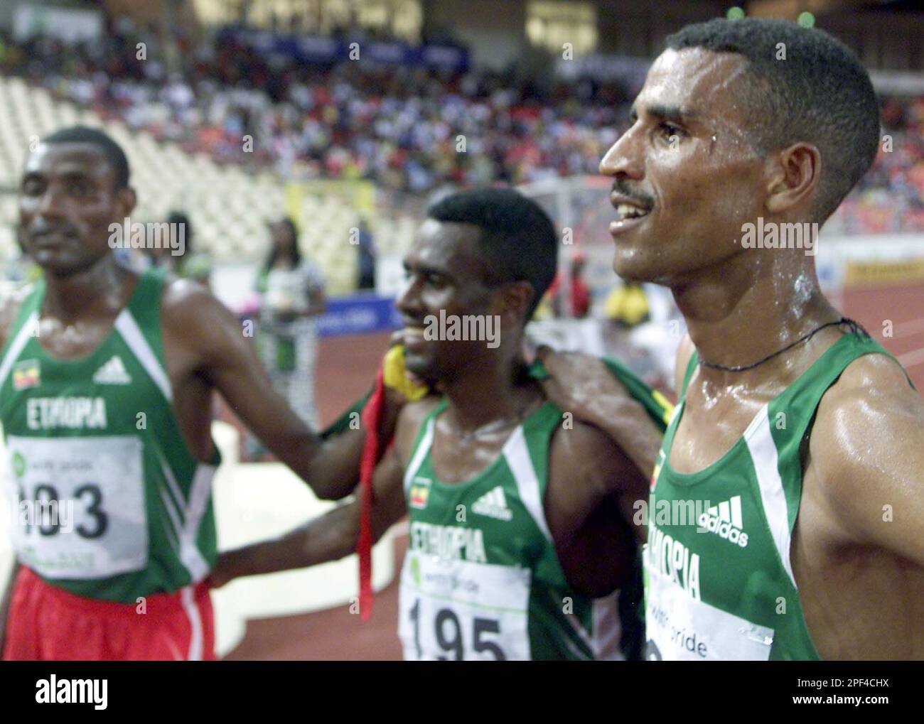 Gebremariam Gebreegziabher, right, who won gold, Sihen Sileshe, center ...
