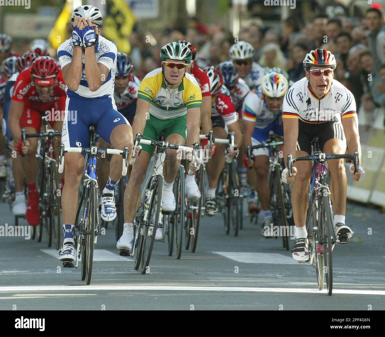German cyclist Erik Zabel of Team Telekom, right, crosses the finish ...