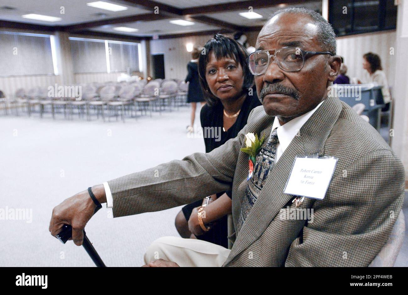 As wife Linda Carter listens, former Air Force machine gunner Robert ...