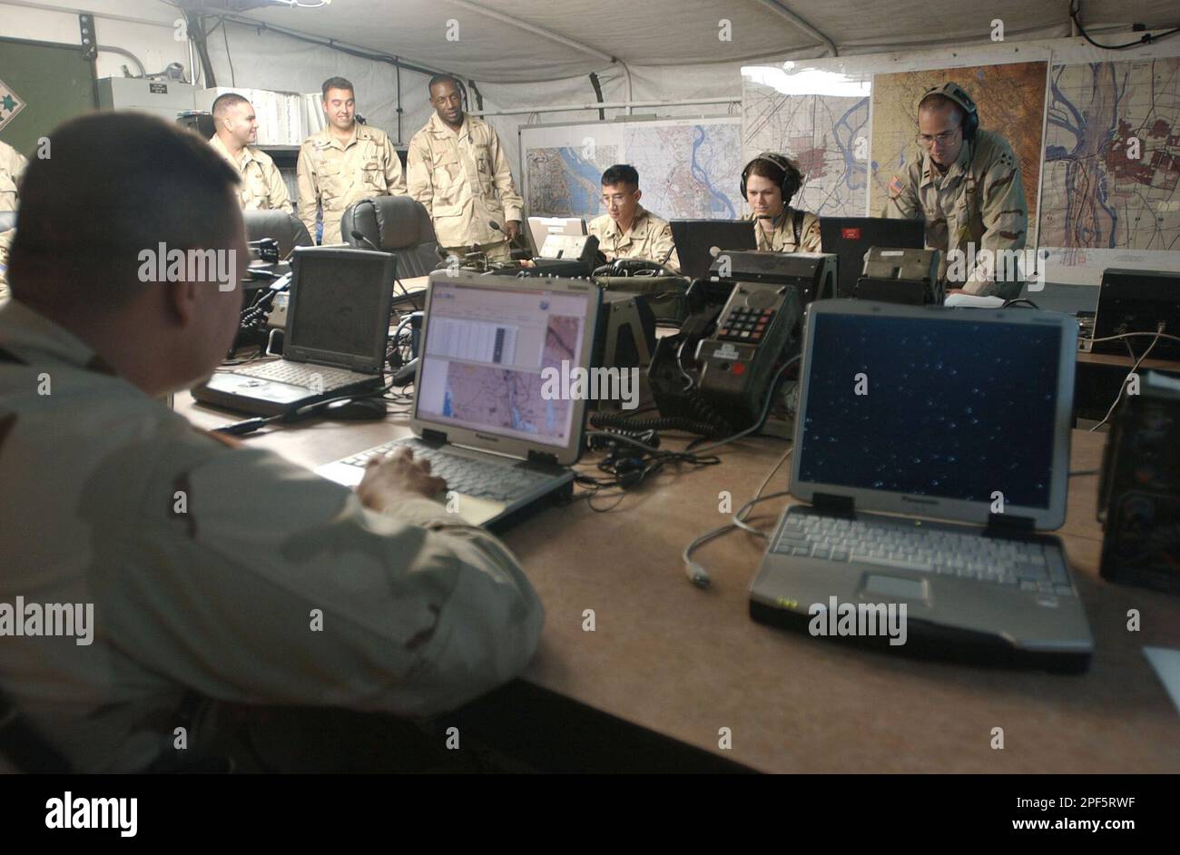 U.S. Army officers work inside the TOC (Tactical Operations Center) of ...