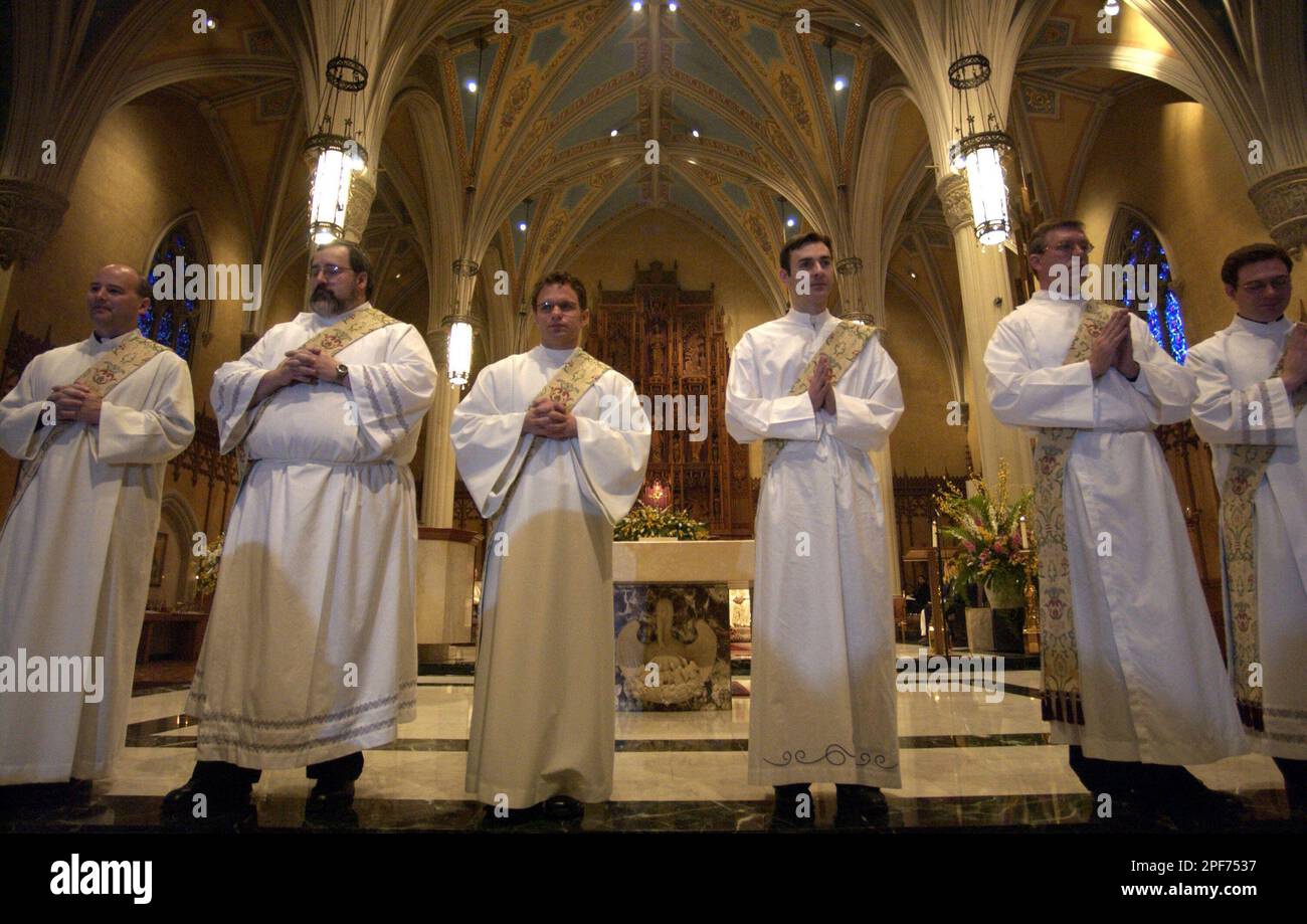 Priests being ordained by Bishop Anthony Pilla, from left, Joseph ...