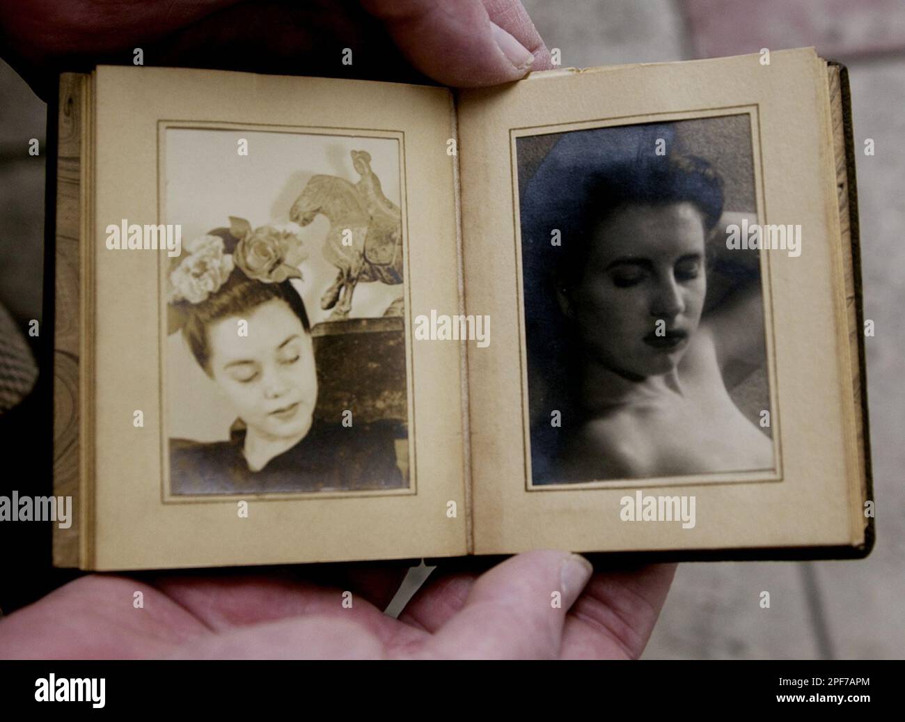 Retired police homicide detective Steve Hodel displays two photographs ...