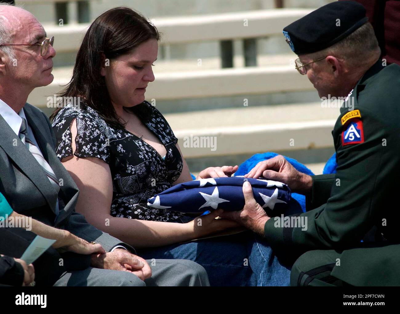 Mayor Gen. Robert Clark, right, of Fort Sam Houston, Texas, hands a U.S ...
