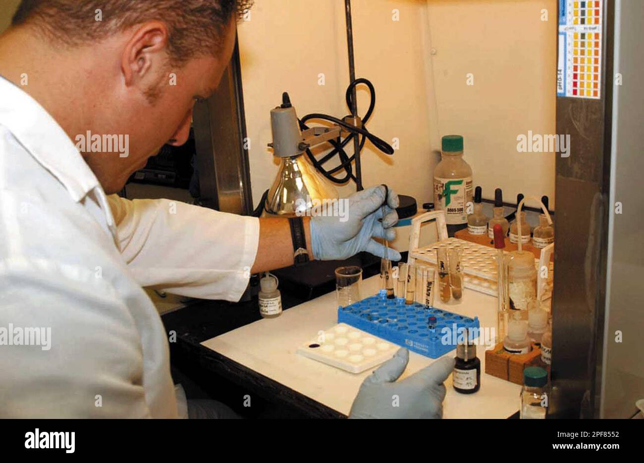 Todd Huml, a crime scene analyst at The Arizona Western Region Crime ...