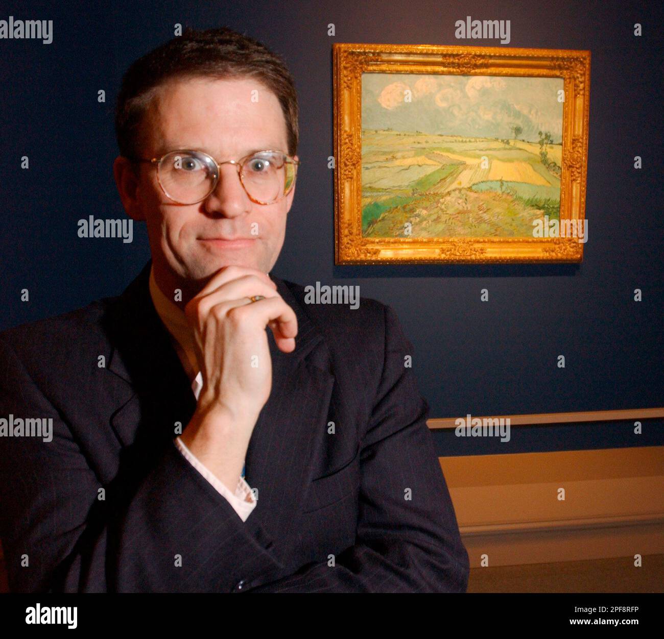 Larry Nichols, curator of the Van Gogh: Fields exhibit, poses for a ...