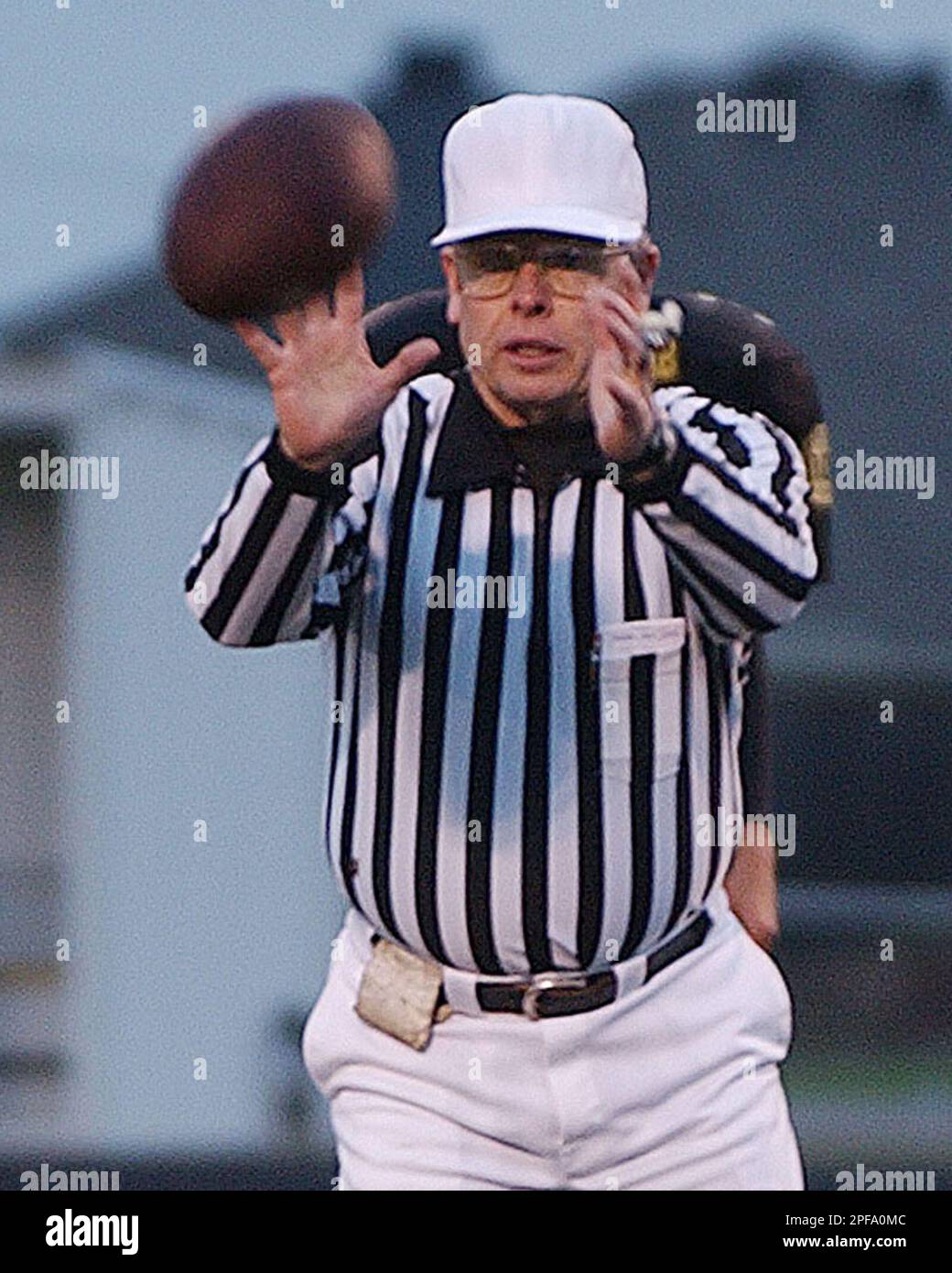 Bill Miller, a retired Air Force colonel, officiates a high school ...