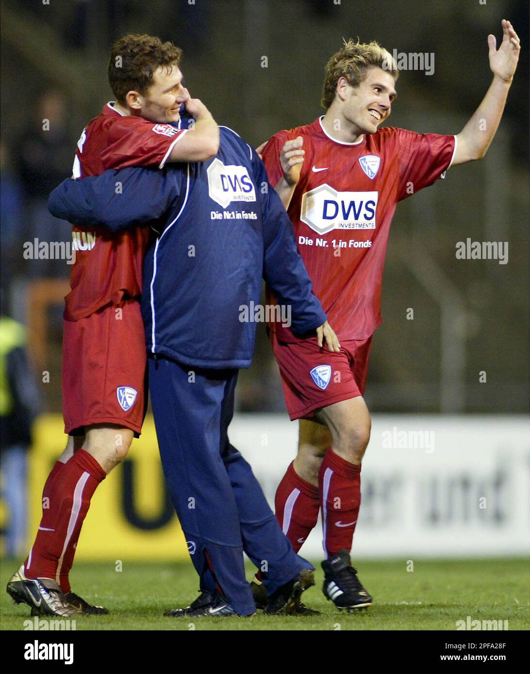 Bochum's Danish player Peter Graulund, right, celebrates his last ...