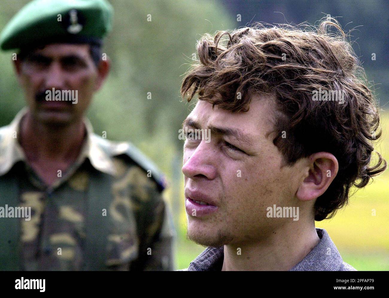 Sher Khan, right, an 18-year-old man who said he was a Pakistani ...