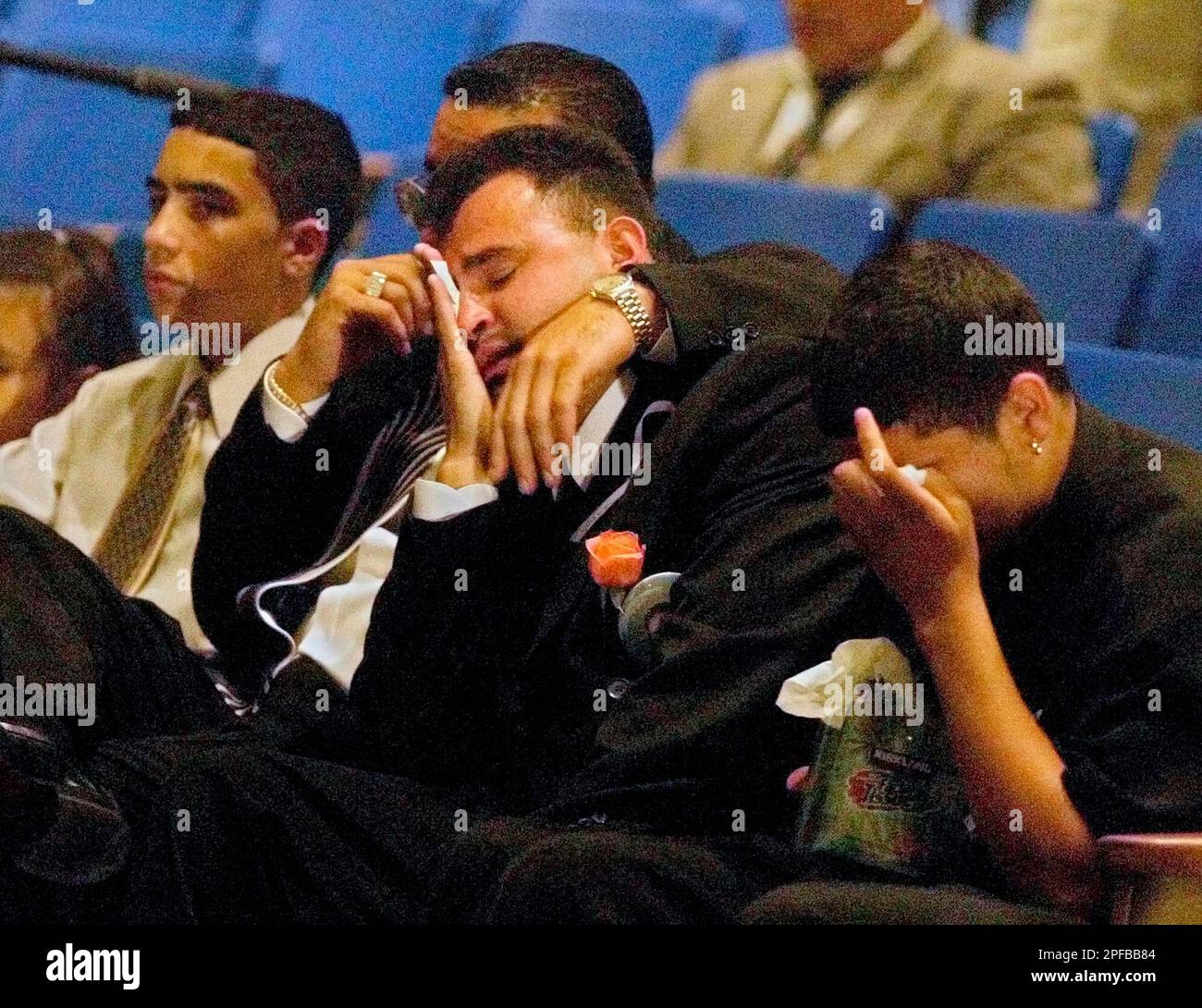 Members of Jazmine Santiago's family mourn her loss during a memorial ...