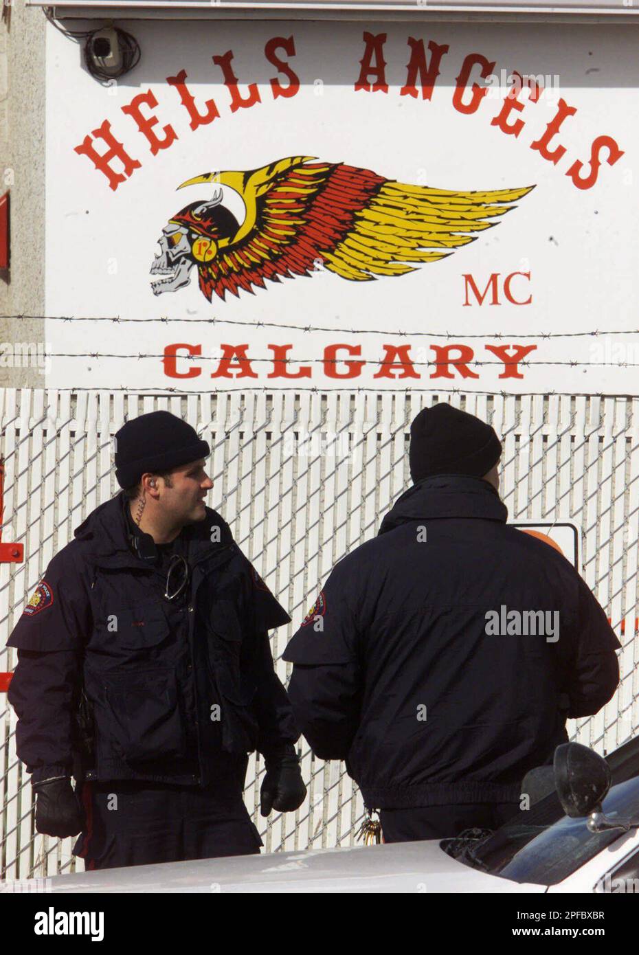 Police officer wait outside the main gate of the Hells Angels clubhouse ...