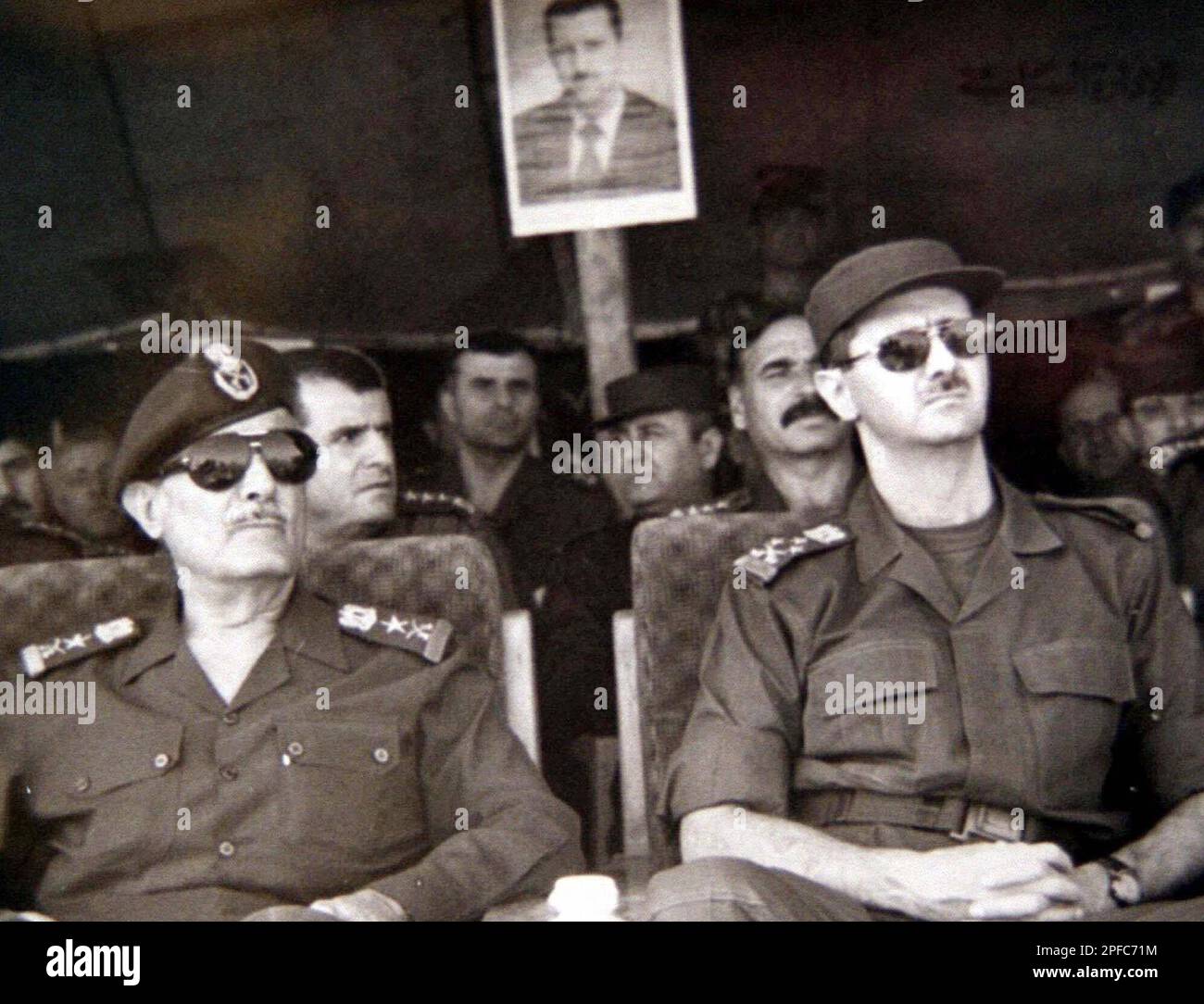 President-elect Lt. Gen. Bashar al Assad, right, attends military ...