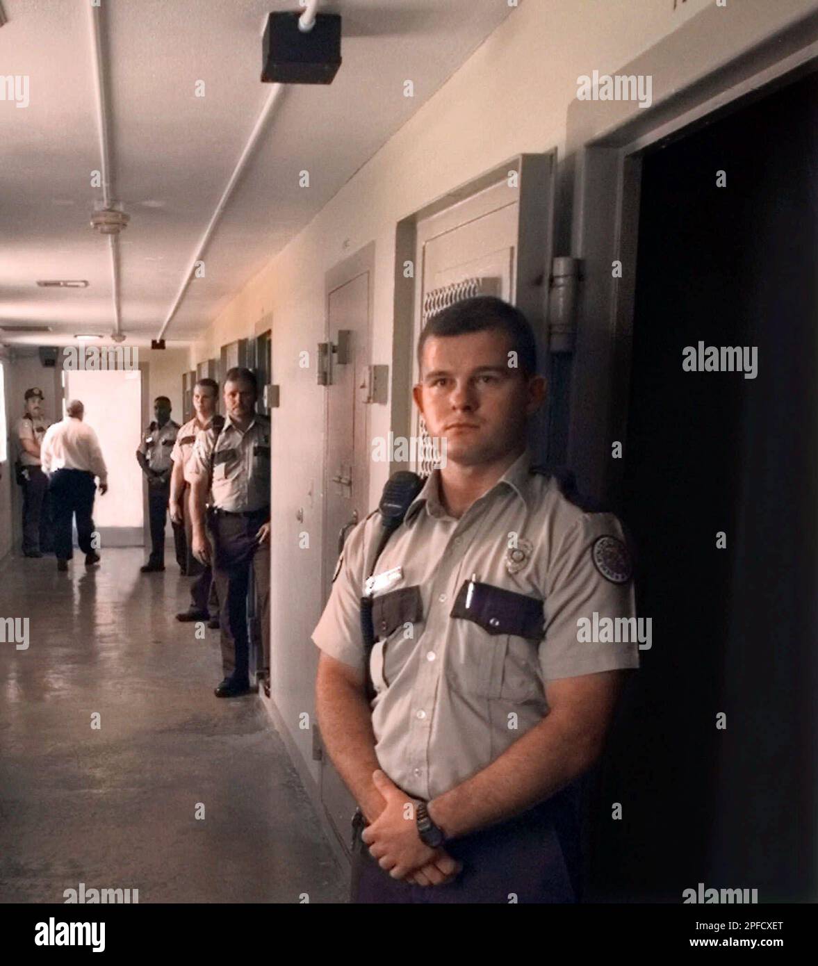 Guards line the hall of X-wing at Florida State Prison during a rare ...