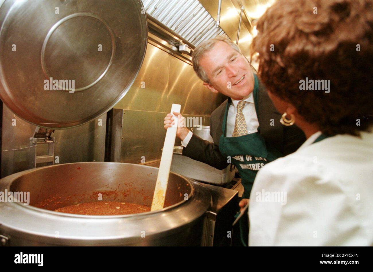Republican presidential hopeful and Texas Gov. George W. Bush stirs a ...