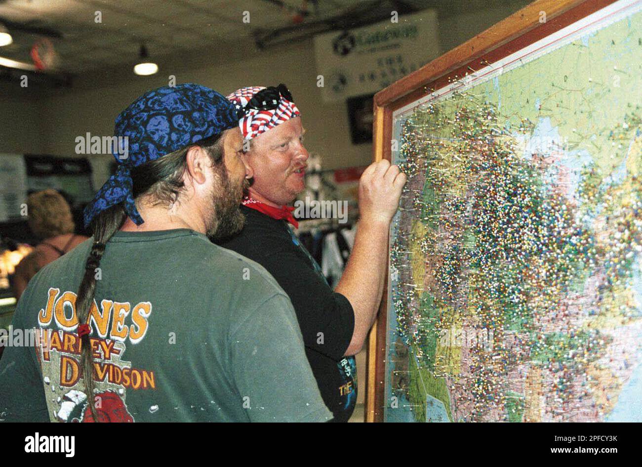 Bob Craigen of Vancouver, Wash., sticks a pin in a large map of the ...
