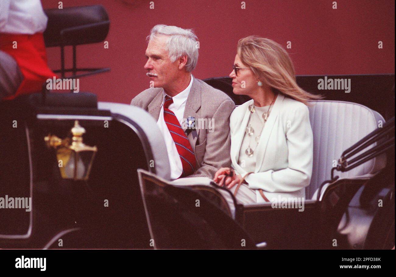 Ted Turner and Jane Fonda arrive by carriage at the premiere of the ...