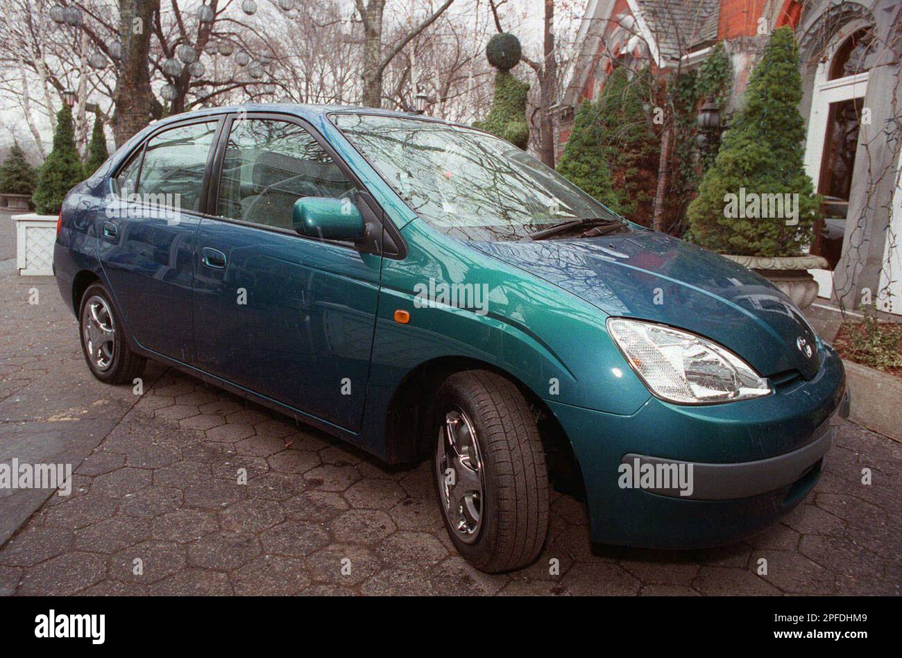 A Toyota Prius, the world's first mass-produced hybrid vehicle, sits ...