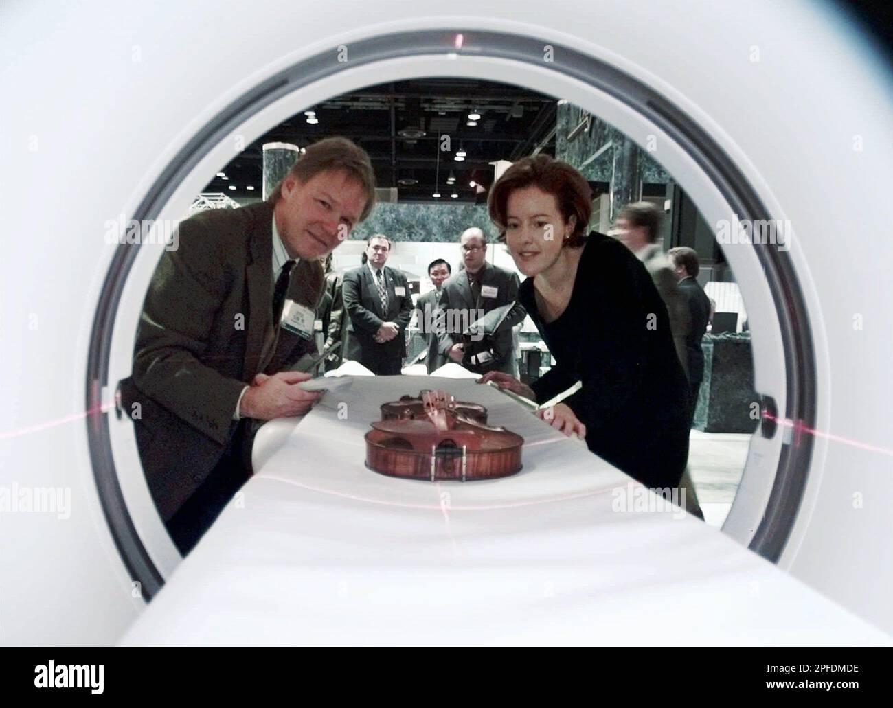 Radiologist Steven Sirr demonstrates for violinist Desiree Ruhstrat a ...