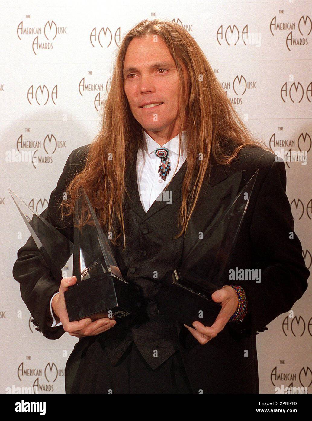 Timothy B. Schmit of the rock group "The Eagles" holds the three awards ...