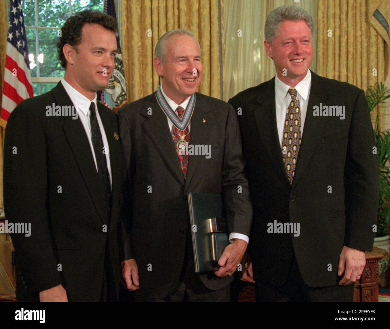 President Clinton poses with actor Tom Hanks, left, and former ...