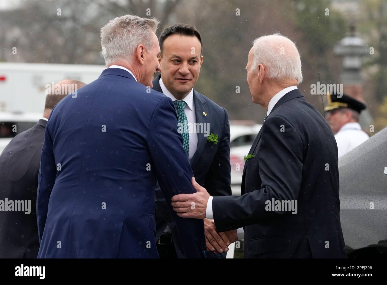 President Joe Biden holds the arm of House Speaker Kevin McCarthy of ...