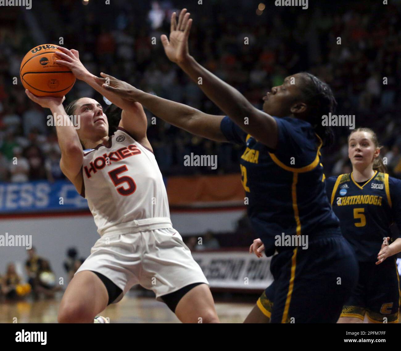 Virginia Tech's Georgia Amoore (5) shoots while defended by Chattanooga ...