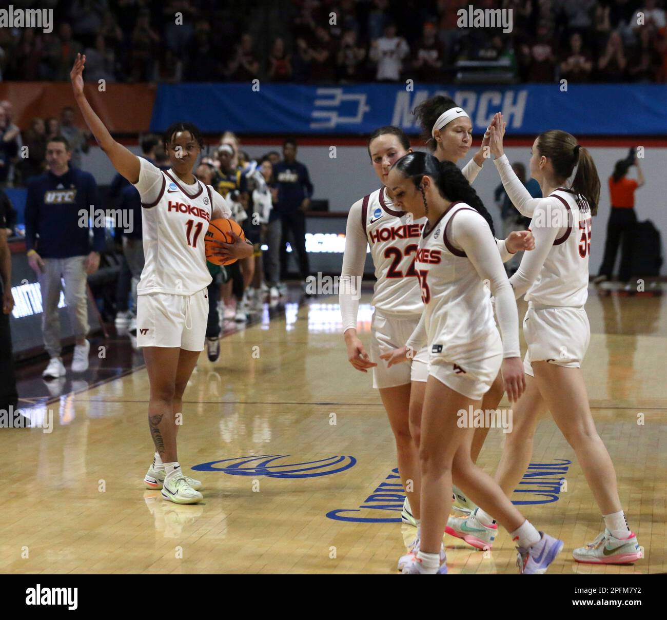 Virginia Tech's D'asia Gregg (11) and teammates celebrate in the final ...