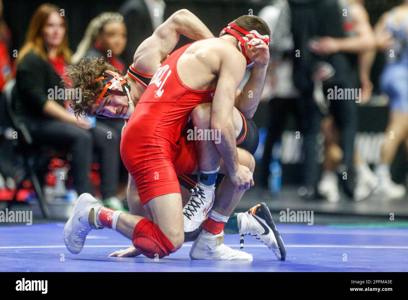 Oklahoma State's Daton Fix, left, scrambles with Cornell's Vito Arujau ...