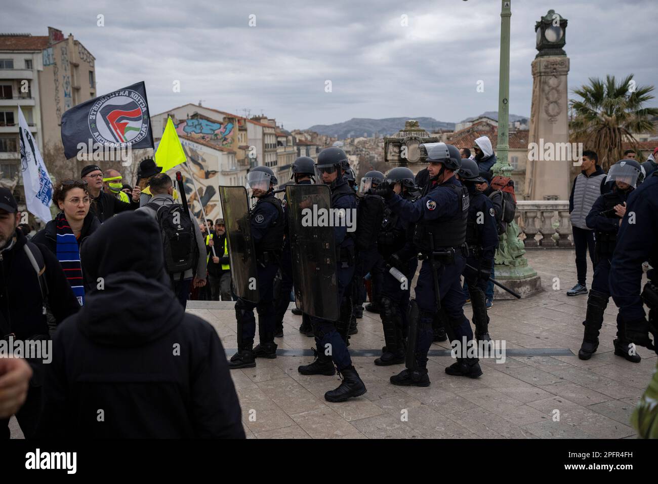 French riot police face protesters in front of the Marseille St ...