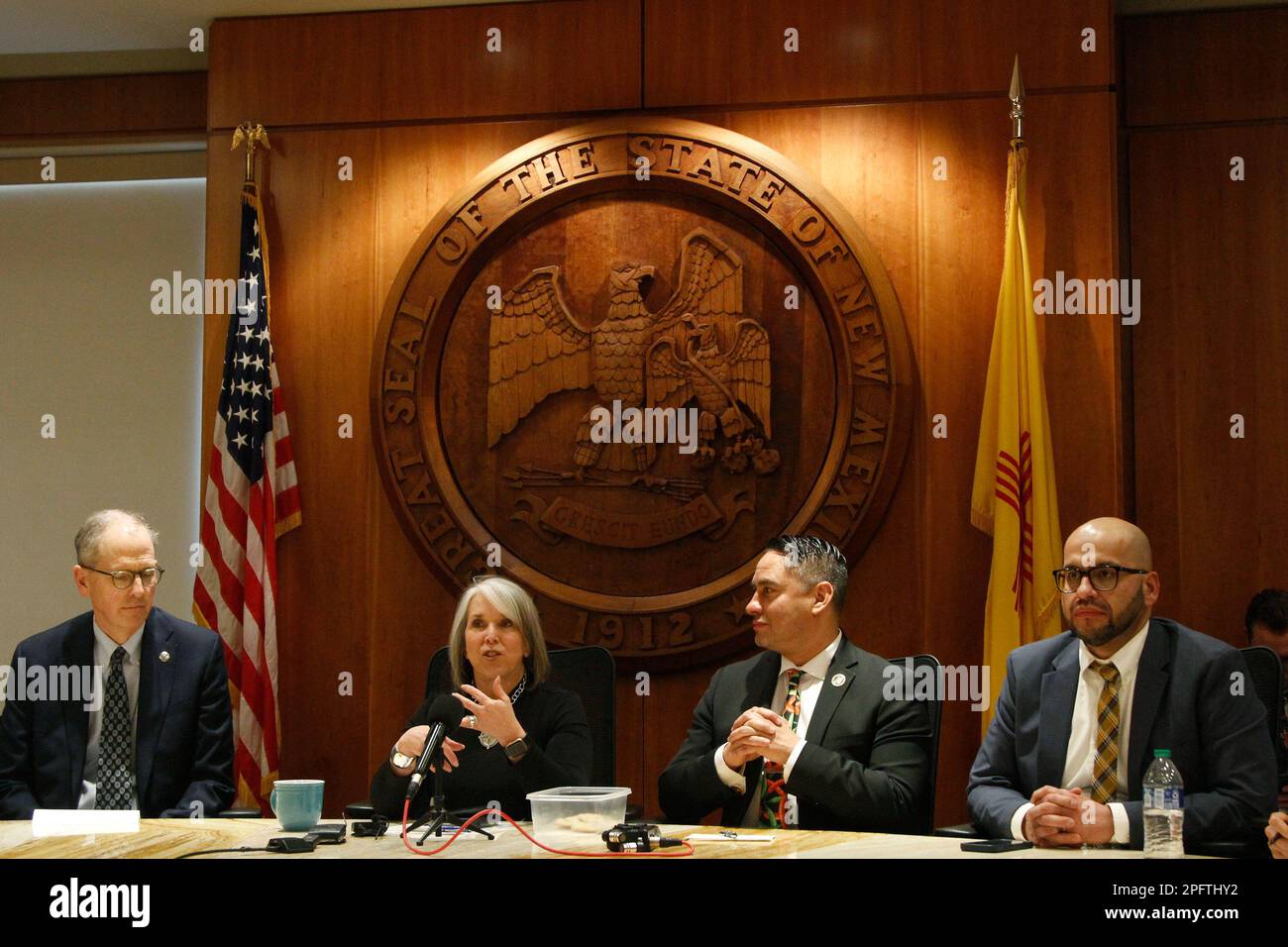 New Mexico Gov. Michelle Lujan Grisham, center left, discusses ...